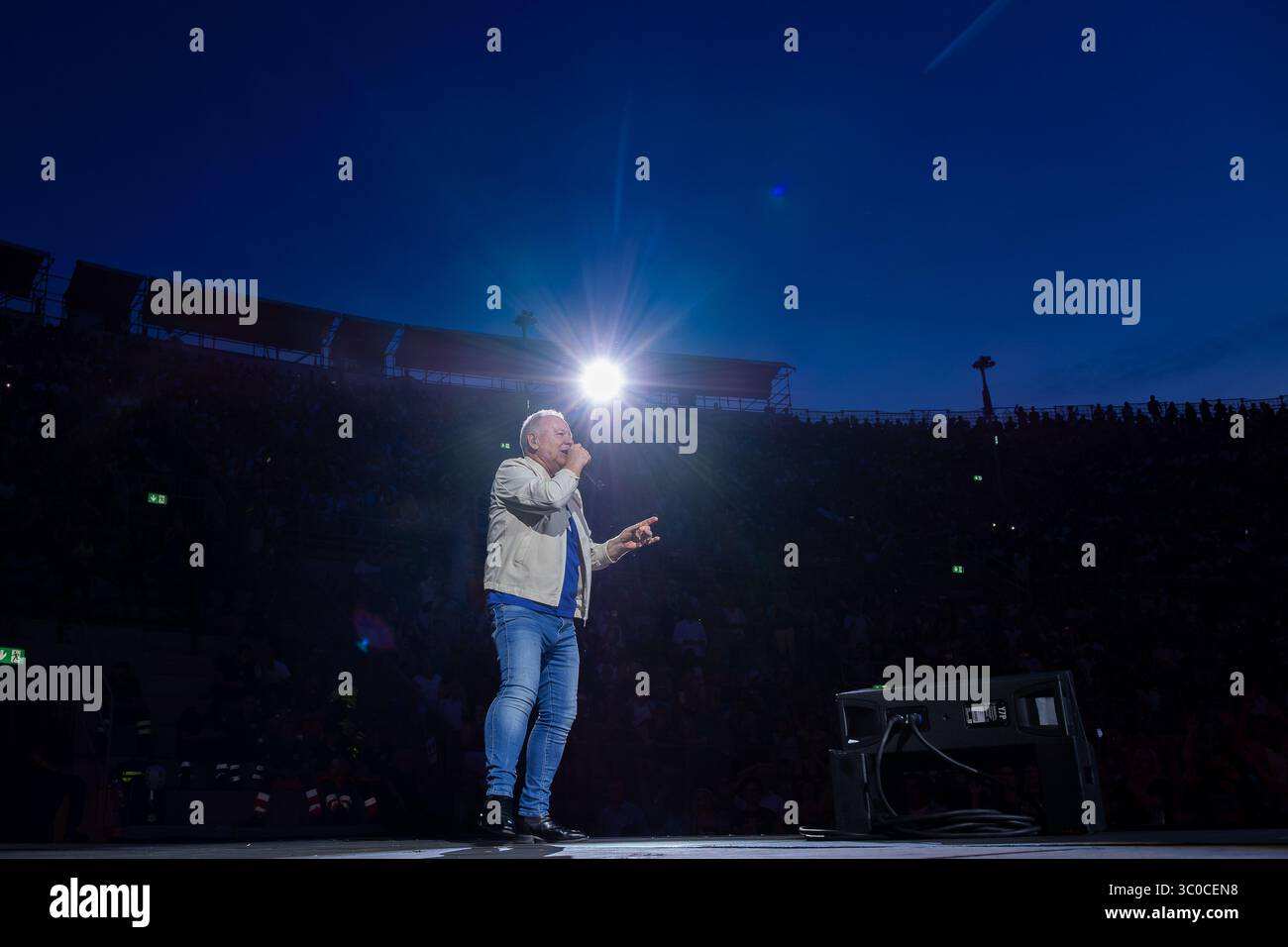 Jim Kerr, lead vocal of Simple Minds on stage during their live concert ...