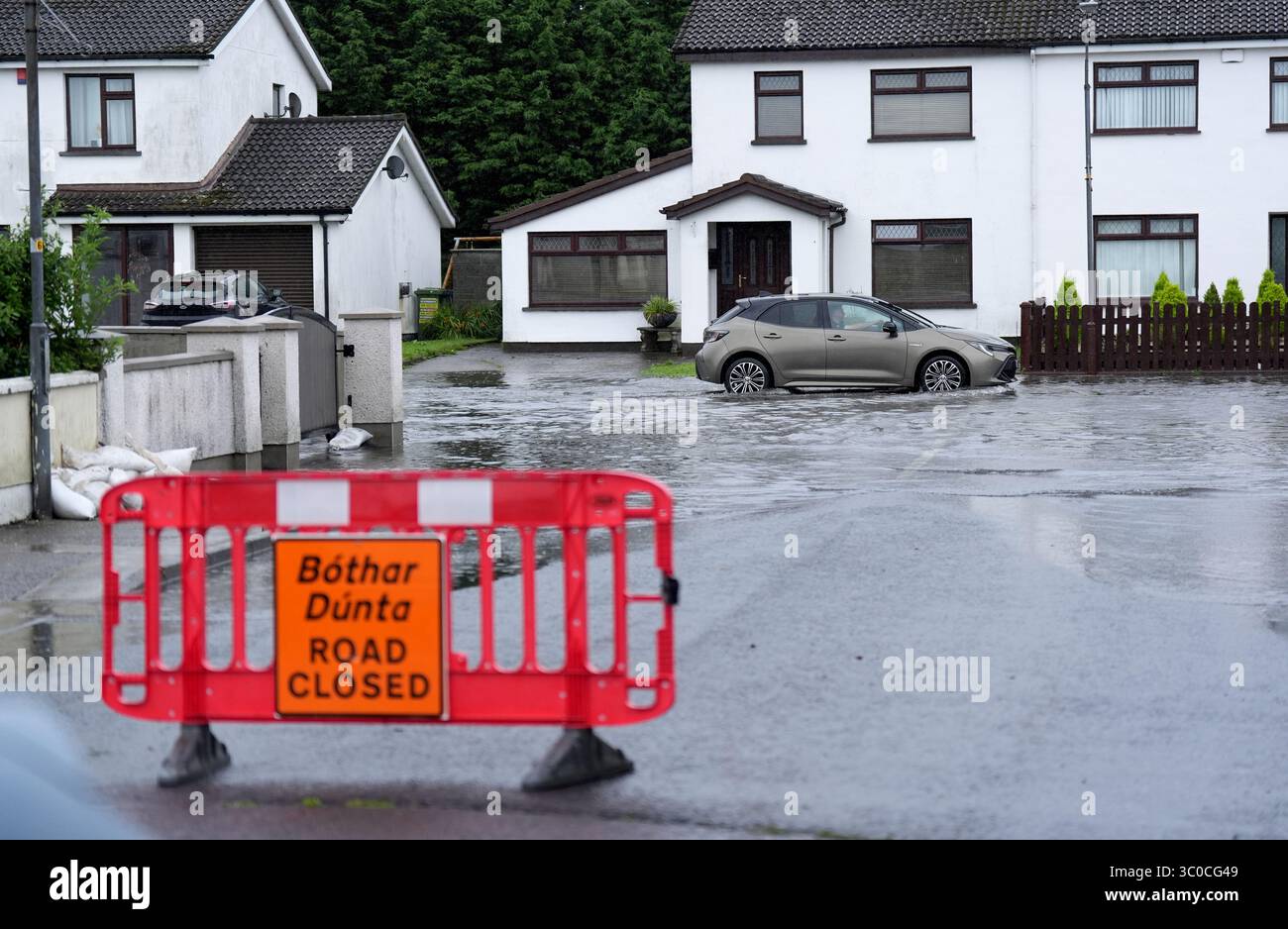 A car drives through flood water on the Bay Estate in Dundalk, Co Louth ...