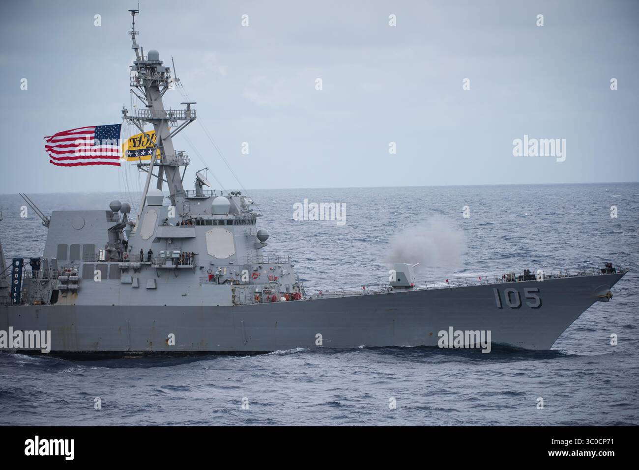 The Arleigh Burke-class guided-missile destroyer USS Dewey (DDG 105) conducts a live-fire ...