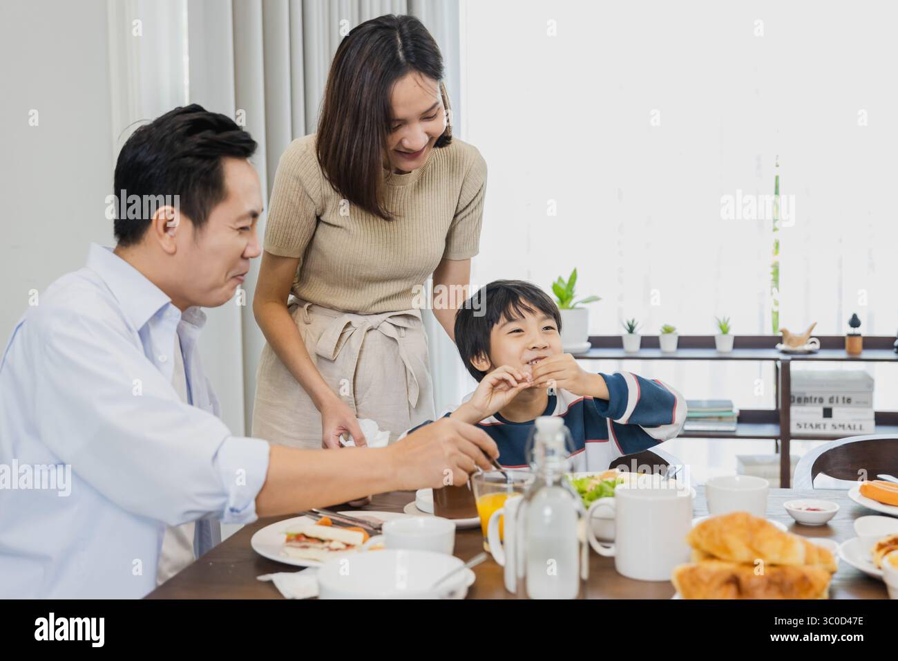 Happy thai family breakfast hi-res stock photography and images - Alamy