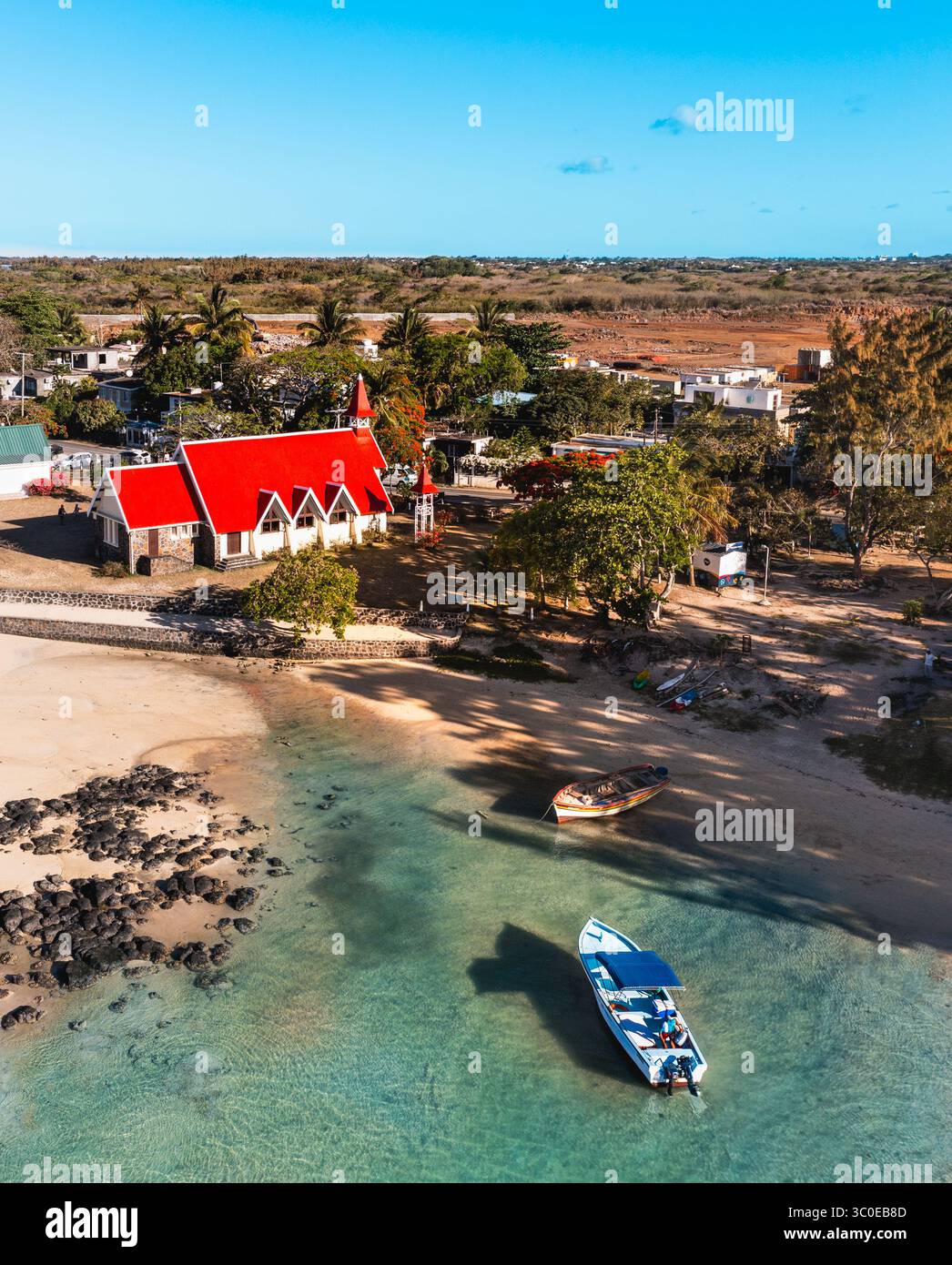 Aerial view of Notre Dame Auxiliatrice Chapel's vibrant red roof ...