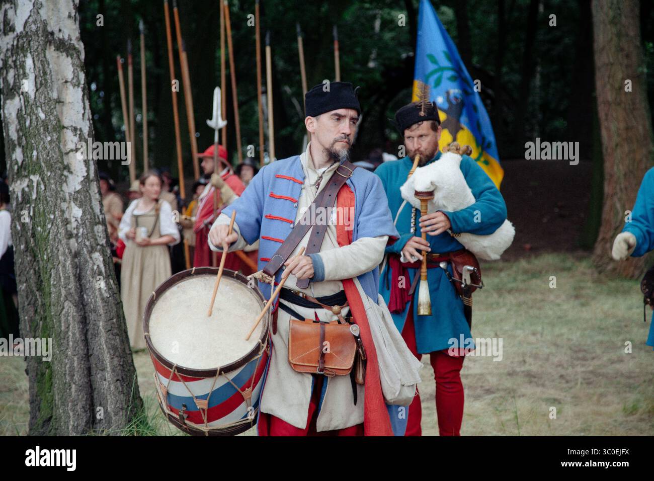 Gdansk, Poland - 06-07-2025 - A man in medieval costume plays the drum ...