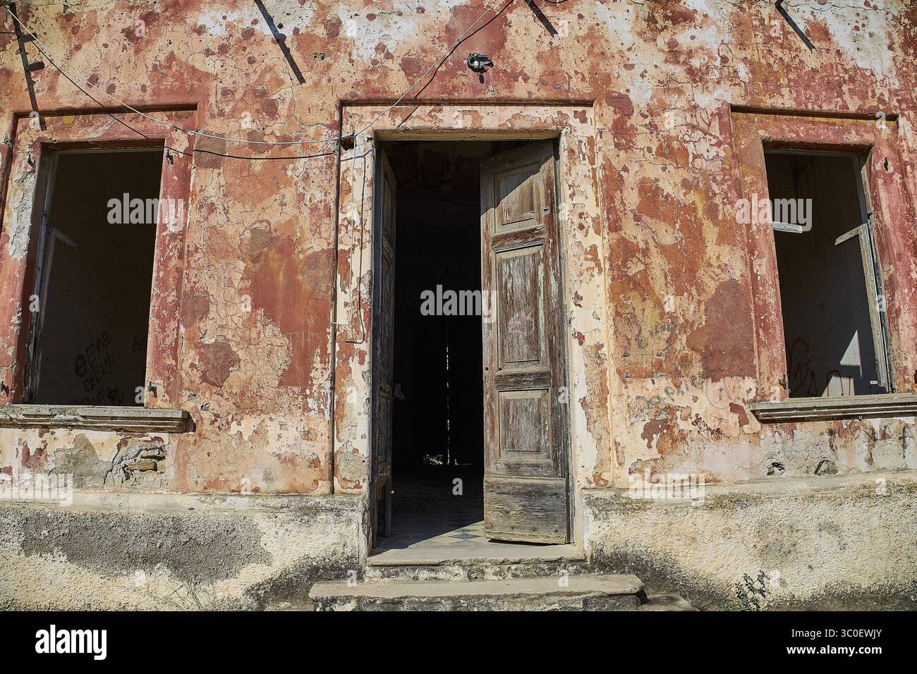 Lost Place, Old facade with open door and peeling plaster, a picture of decay, Radio Station ...