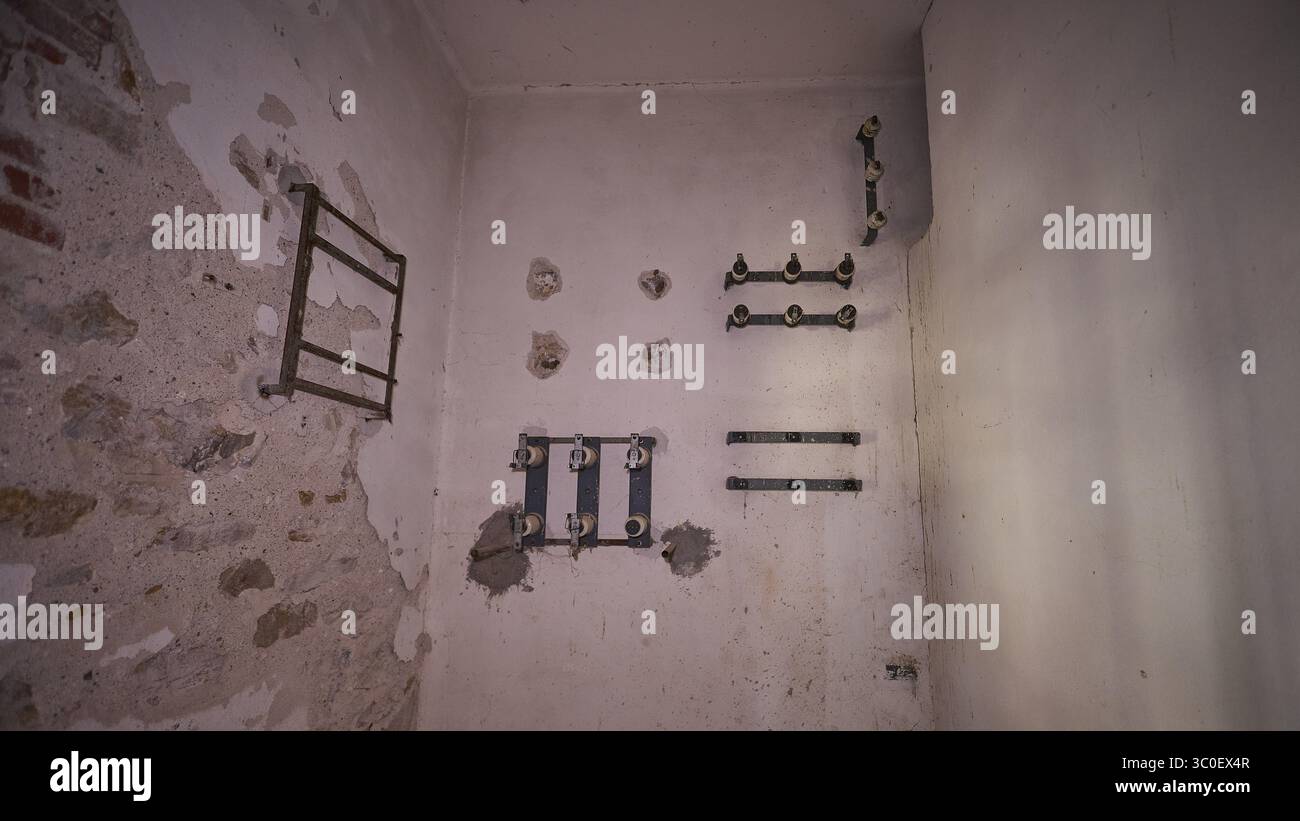 Lost Place, An empty white room with remains of pipes on the walls ...