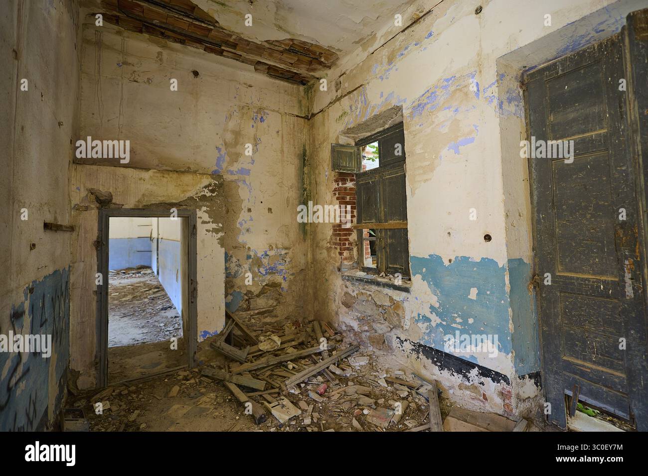 Lost Place, Dilapidated interior with rubble and crumbling walls ...
