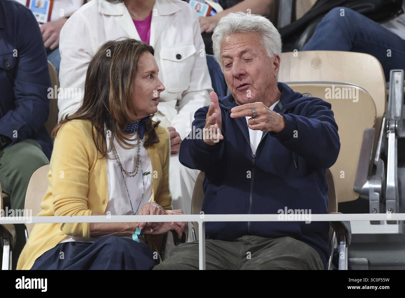 Actor Dustin Hoffman and his wife Lisa sitting courtside during a match ...