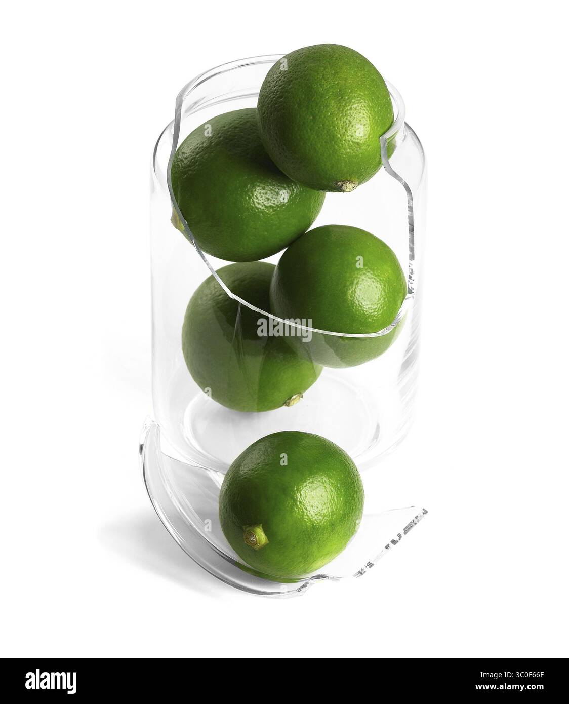Shattered glass jar with lime on white background Stock Photo - Alamy