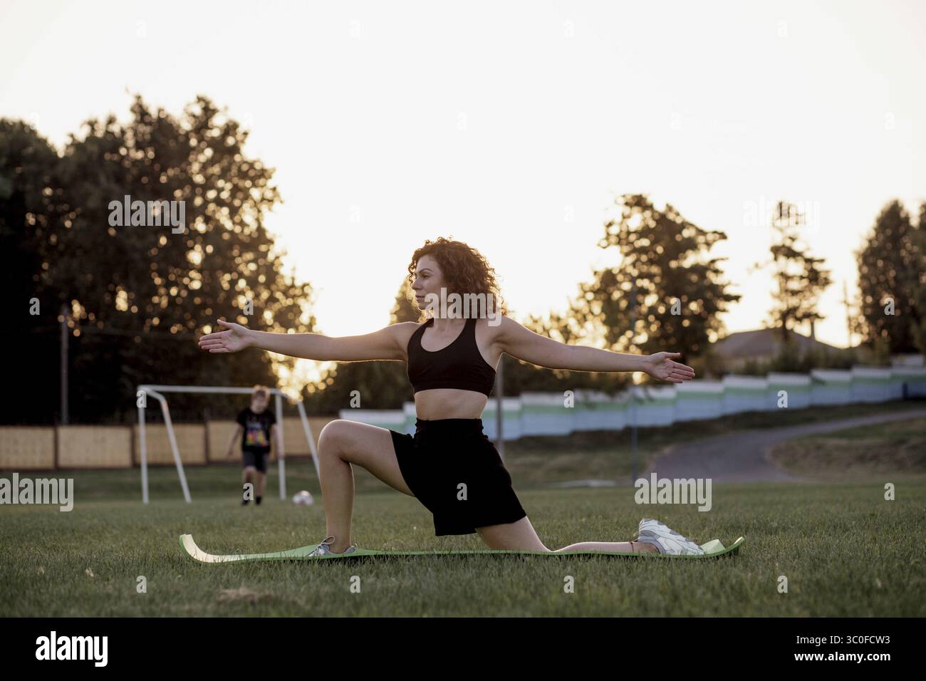 Woman extending arms in fitness hi-res stock photography and images - Alamy