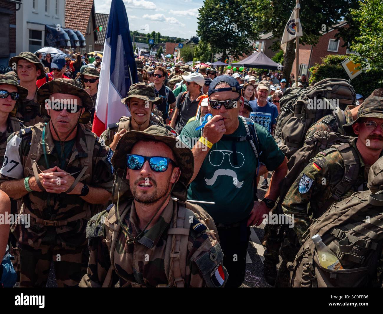 The French army and walkers are seen waiting to keep going. The ...