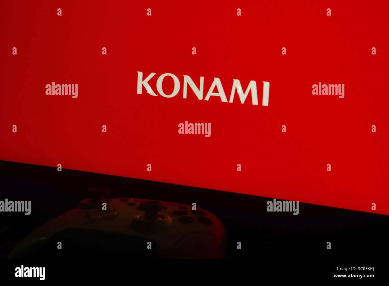 Konami logo on a red screen with a game controller revealed at the ...