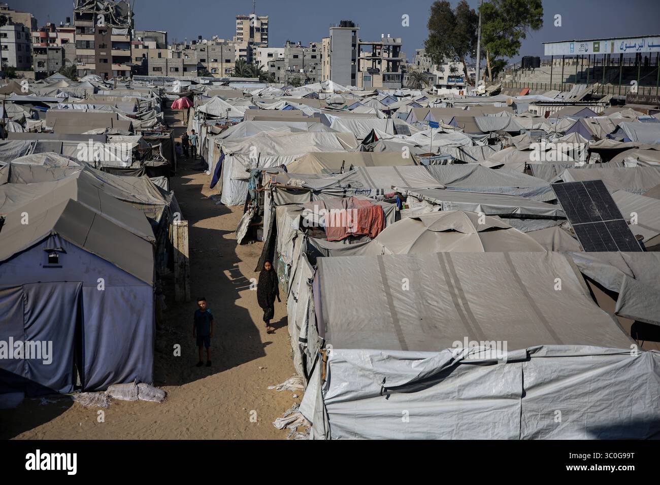 Palestinian families without a place to stay are seen struggling to ...