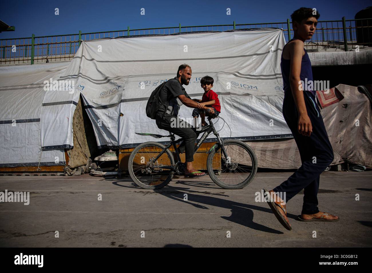 Palestinian families without a place to stay are seen struggling to ...