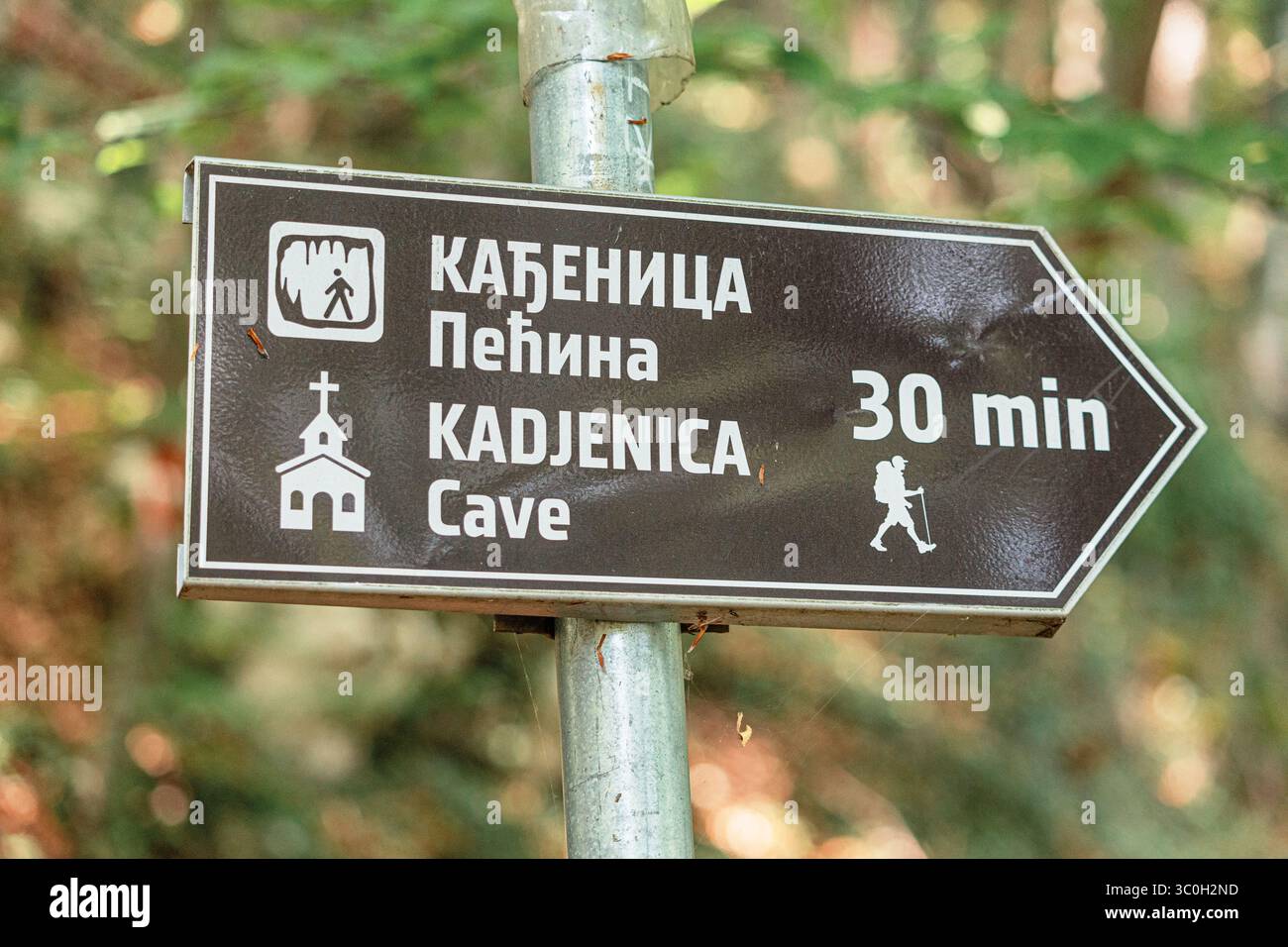 11 June 2025, Ovcar Banja, Serbia: Brown hiking trail sign pointing ...