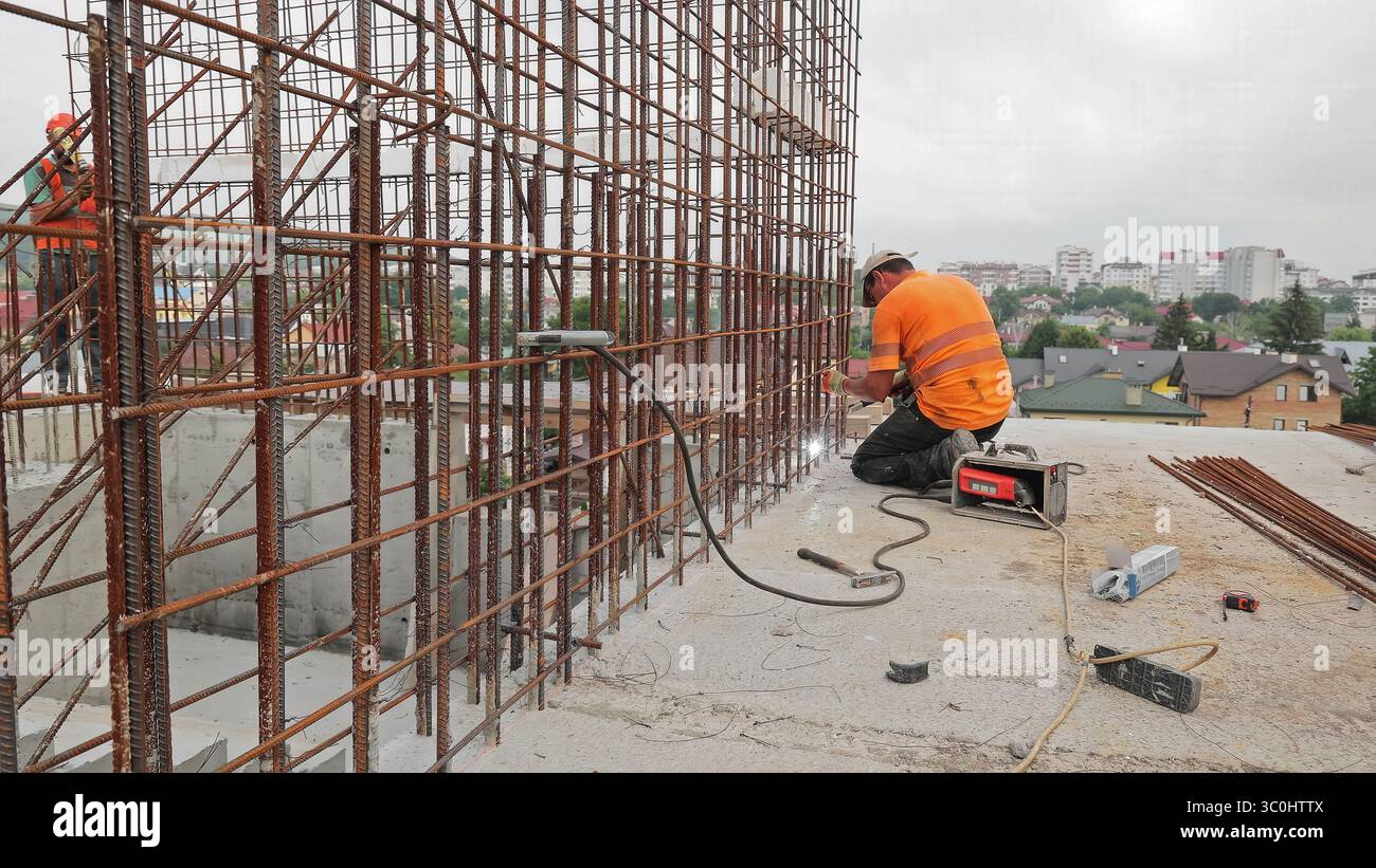 Construction Worker Welding Steel Reinforcement Framework. A ...