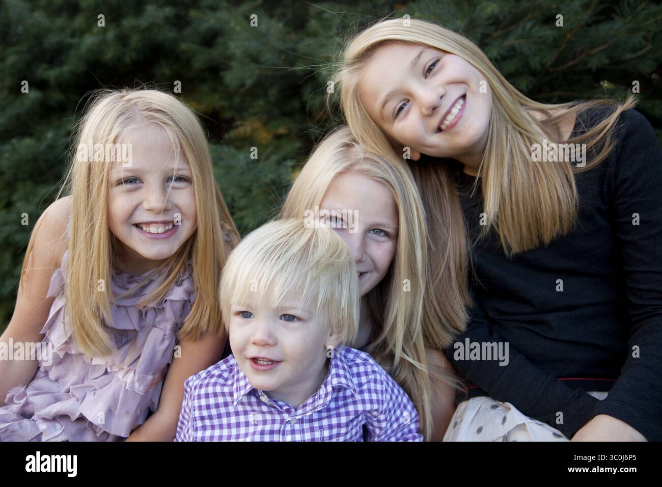 October 3, 2010 - New York, New York, U.S - Four Smiling Siblings ...