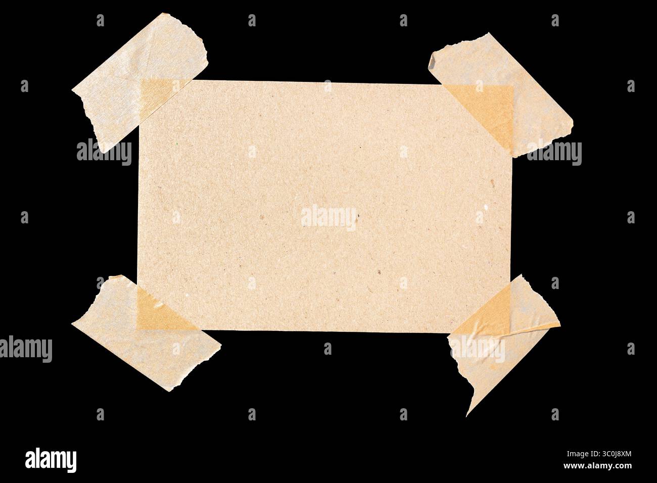 rectangular piece of blank brown paper affixed with four masking tape ...