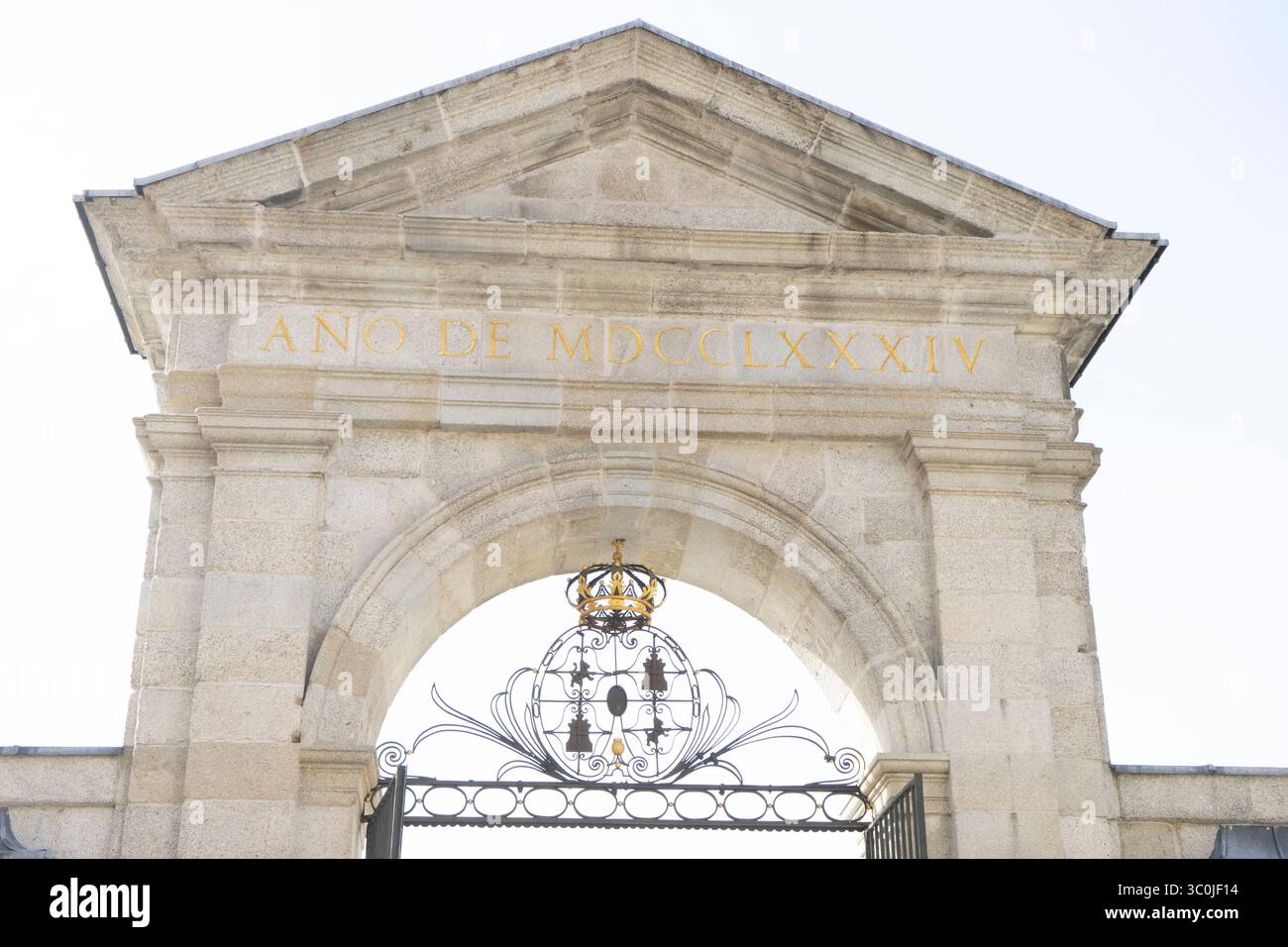 An ornate stone archway stands proudly at the entrance to Jardines del ...