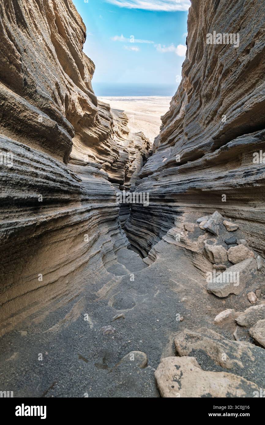 Unique volcanic rock formations at Las Grietas in Lanzarote. Deep ...