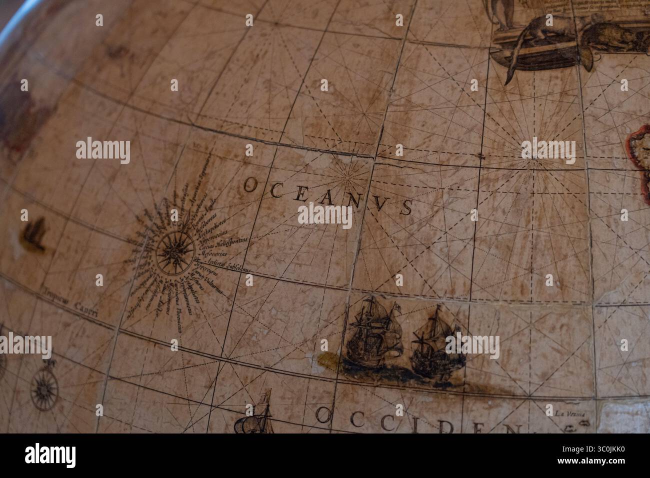 Close-up view of a vintage globe featuring detailed cartography. The ...