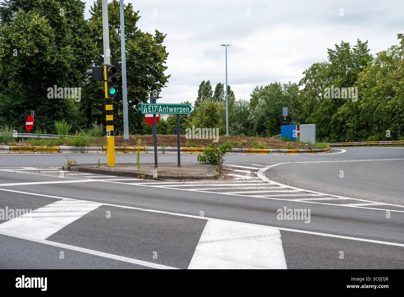 Roundabout and direction sign post to the E 17 highway to Antwerp in ...