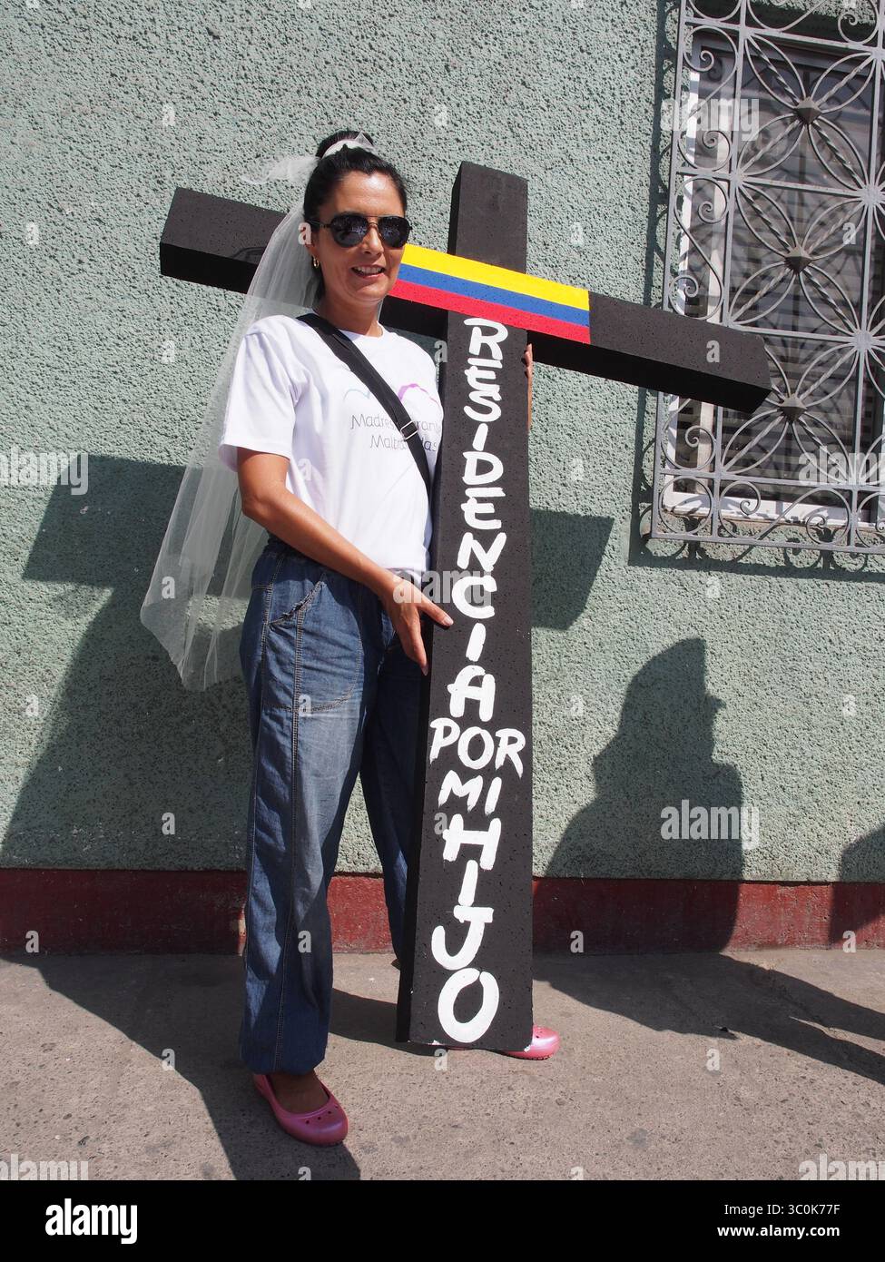 May 6, 2016 - Lima, Lima, Peru - A woman carries a black cross marked ...