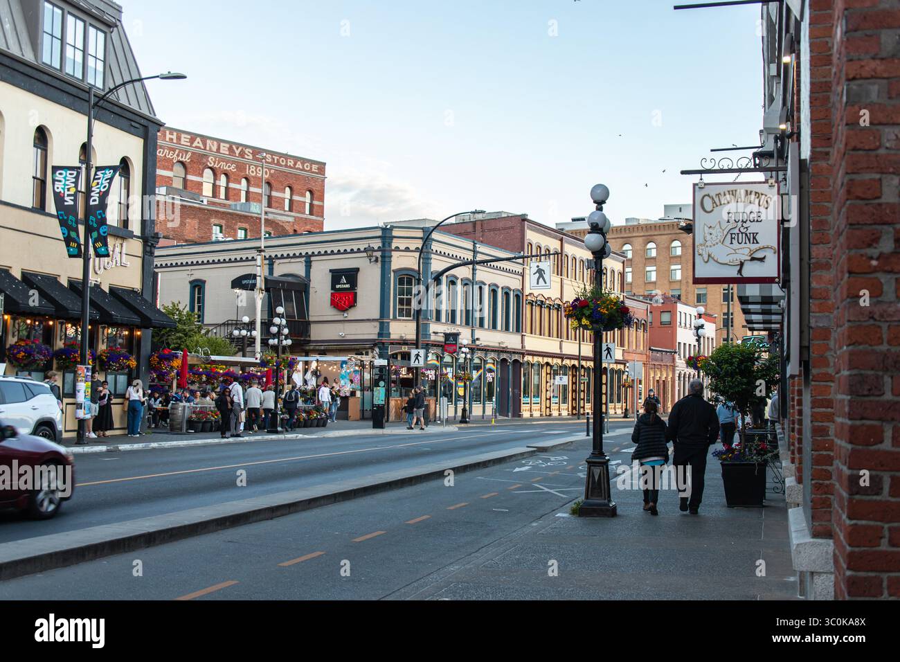 Bustling downtown Victoria scene with heritage buildings, pedestrians ...