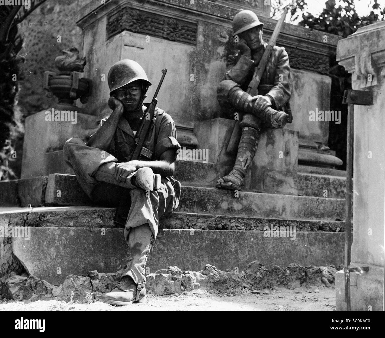 On the steps of a monument to the fallen of the First World War, a U.S ...