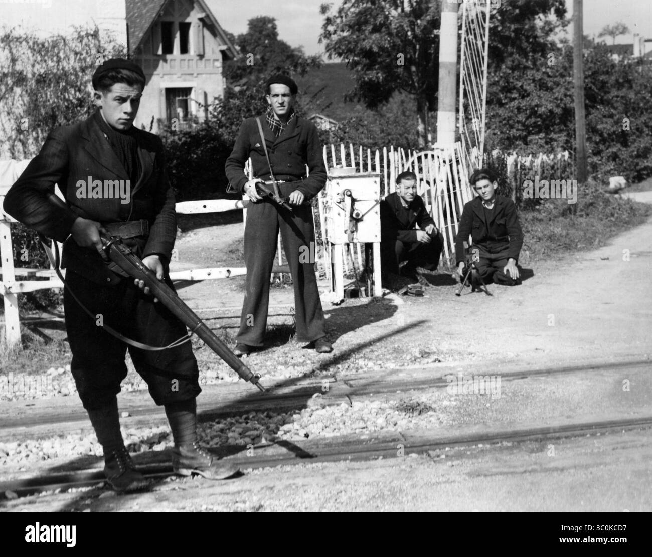 French partisans controlling a checkpoint on the road to Switzerland ...