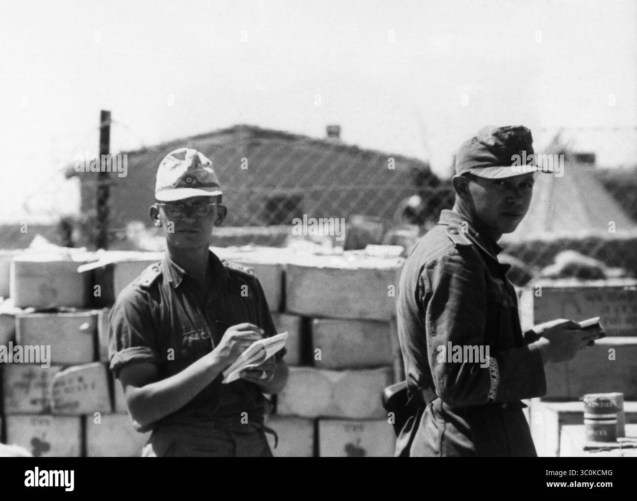 German soldiers counting the war materials and subsistence abandoned by ...