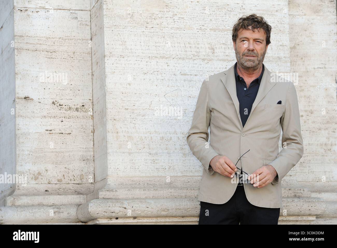 Italian actor Massimo Ciavarro attends the photocall of the film Natale ...