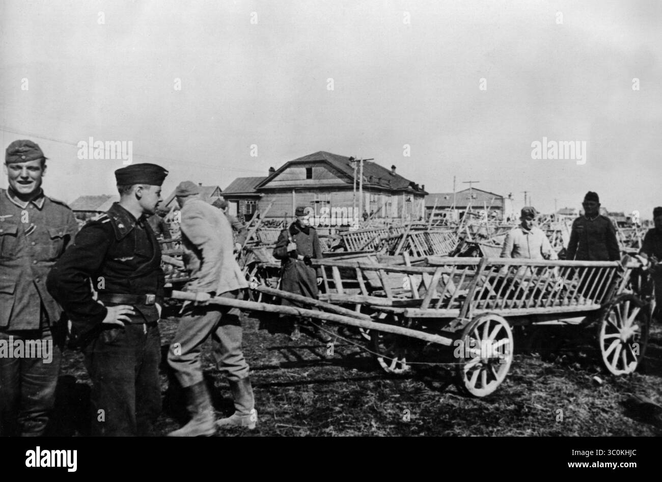 German soldiers preparing the carts necessary for transport during ...