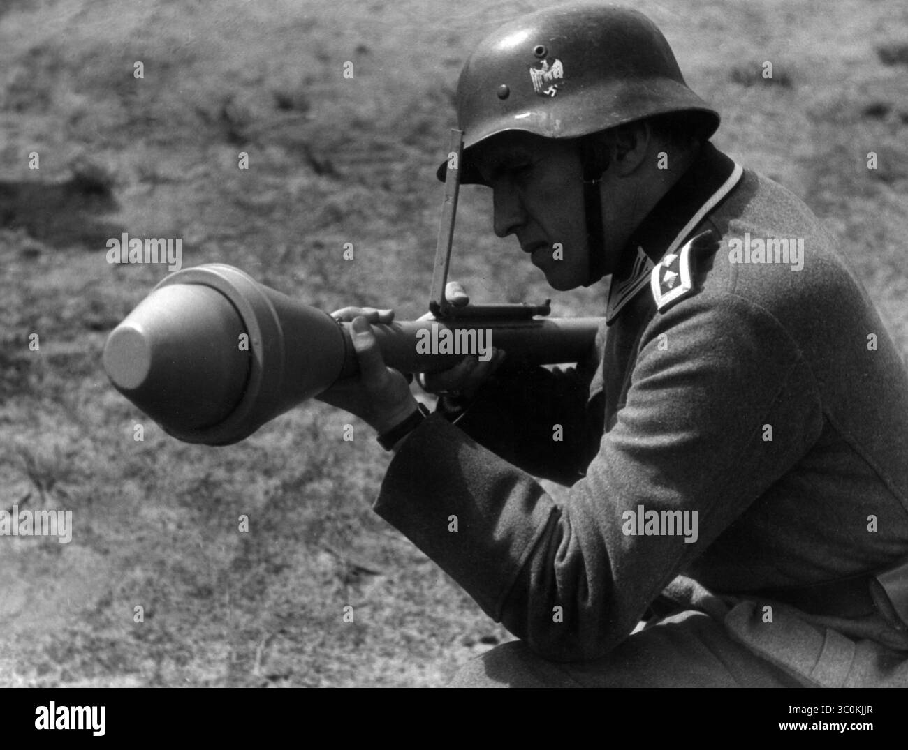 A German N.C.O. instructor armed with a 'panzerfaust' during training ...