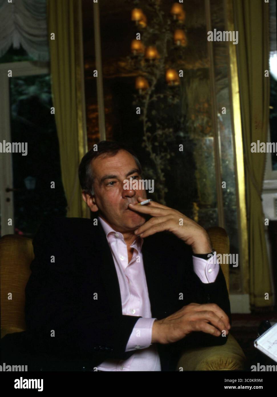 The French director smoking a cigarette in a salon. 1980s (Credit Image ...