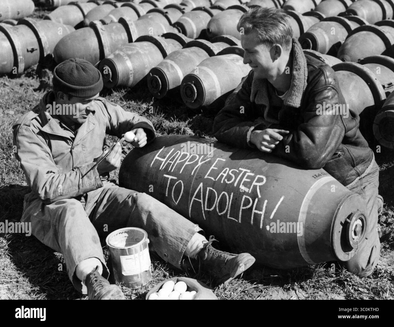 Two U.S. soldiers writing funny Easter greetings to Hitler on a bomb ...