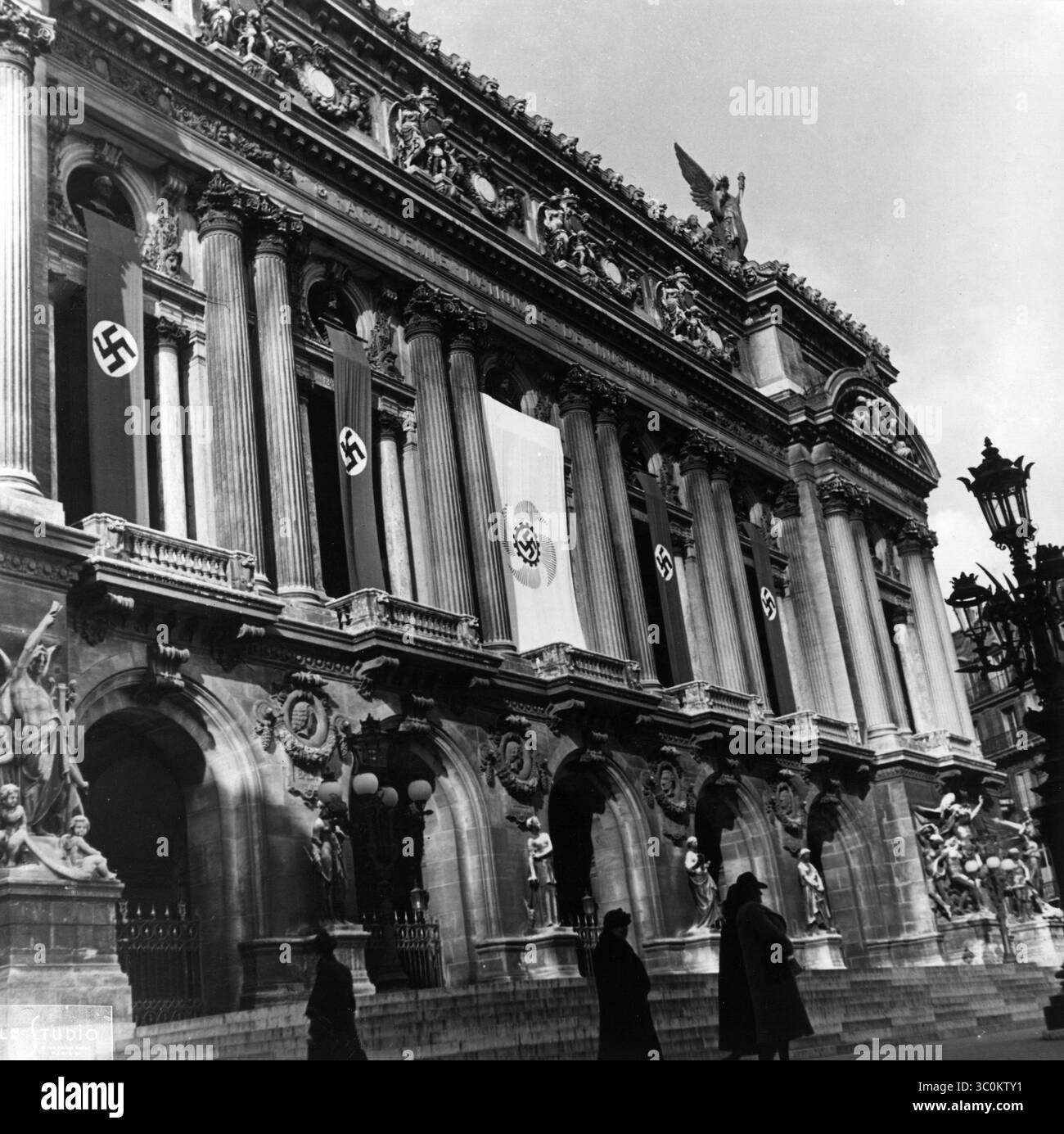 Nazi flags, symbols of the German occupation, hanging from the French ...