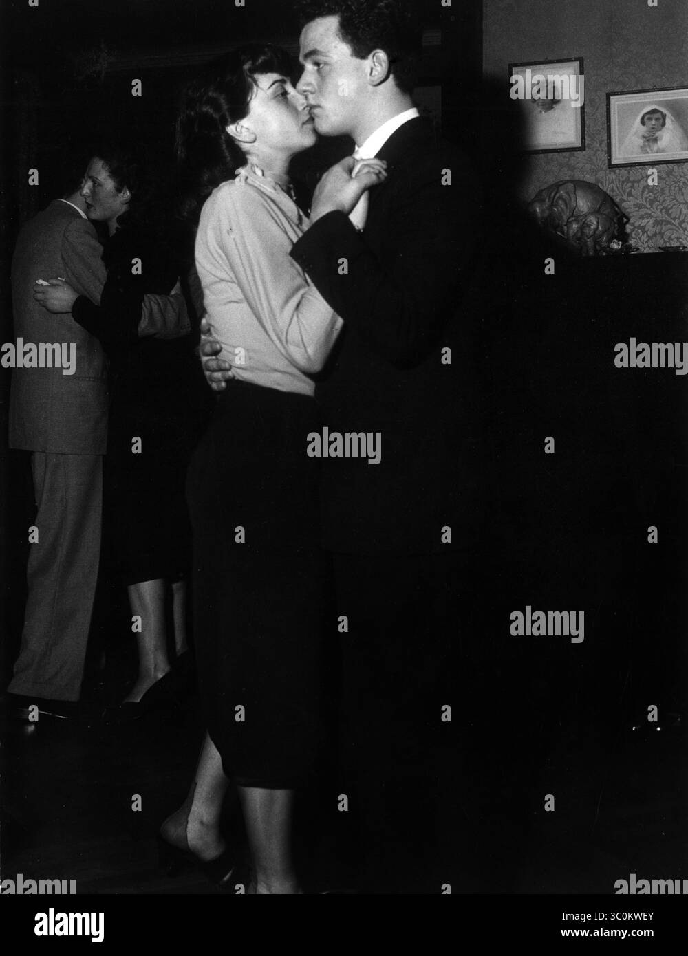 A couple holding tight while dancing a slow dance. Italy, 1951 (Credit ...