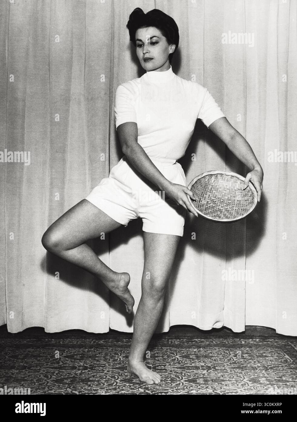 Portrait of Italian actress Silvana Mangano balancing on one foot ...
