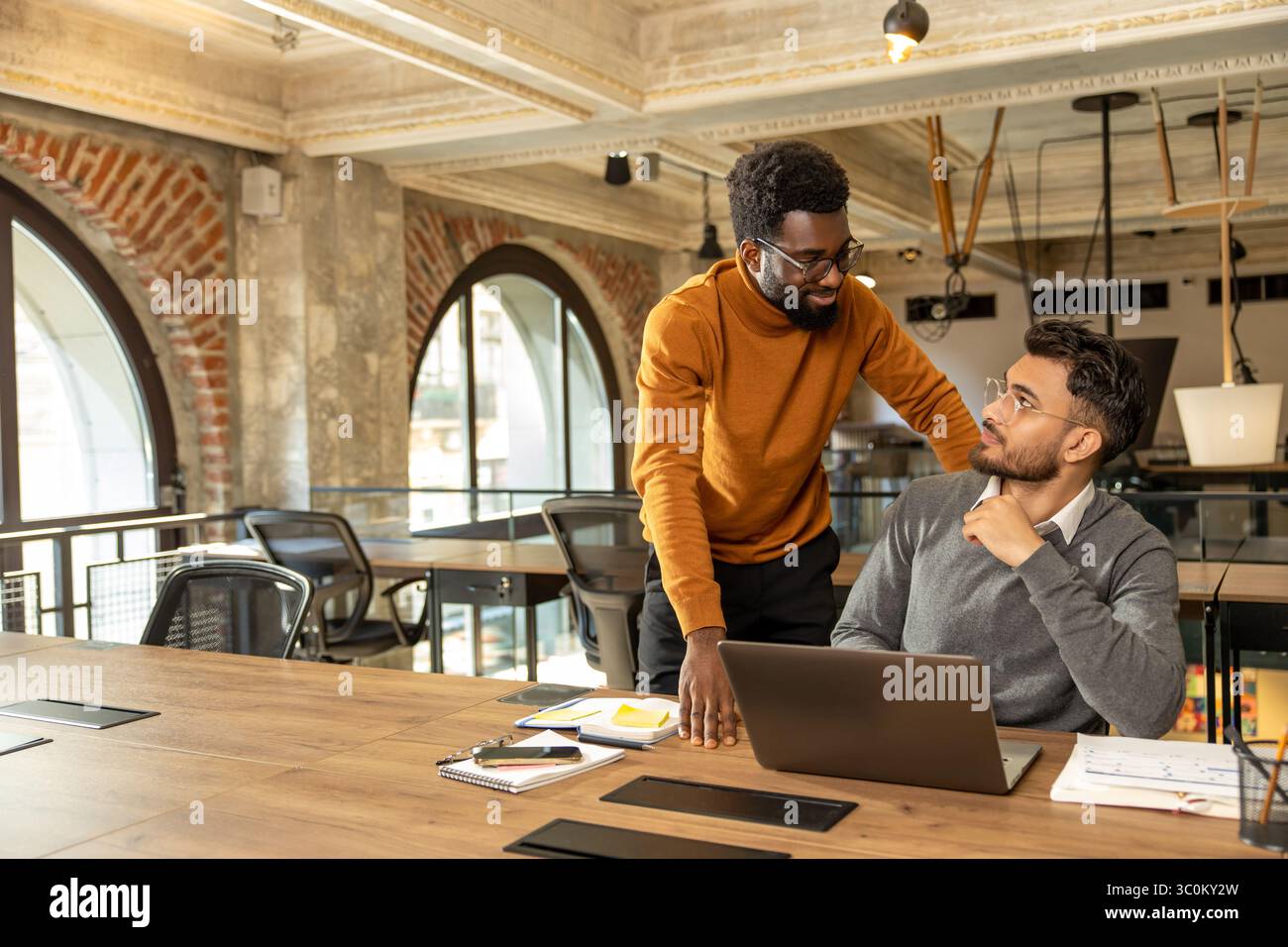 Colleagues working in the office and looking busy Stock Photo - Alamy