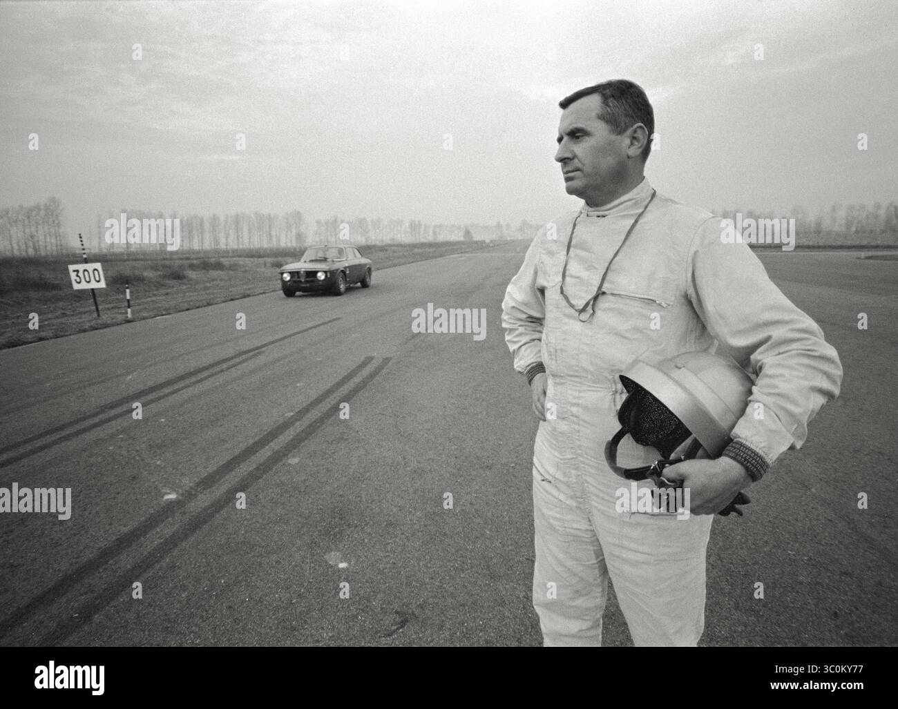 A test driver of the Alfa Romeo Italian car company standing on the ...