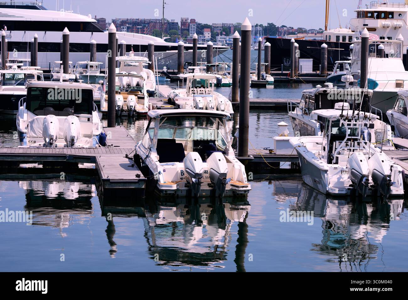 Pleasure power boats are docked on Boston Harbor in the Seaport ...