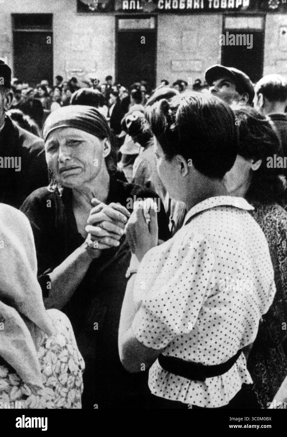 Some Polish women crying at the news that their relatives have been ...