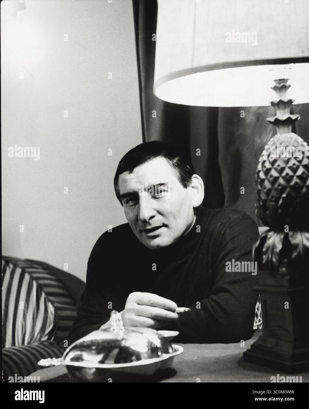 Italian actor, comedian and singer-songwriter Renato Rascel smoking a ...