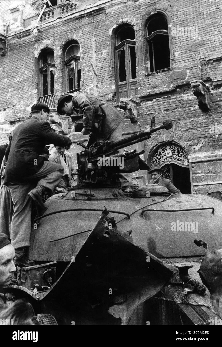 Hungarian revolution in 1956. Hungarian insurgents jumping on a just ...