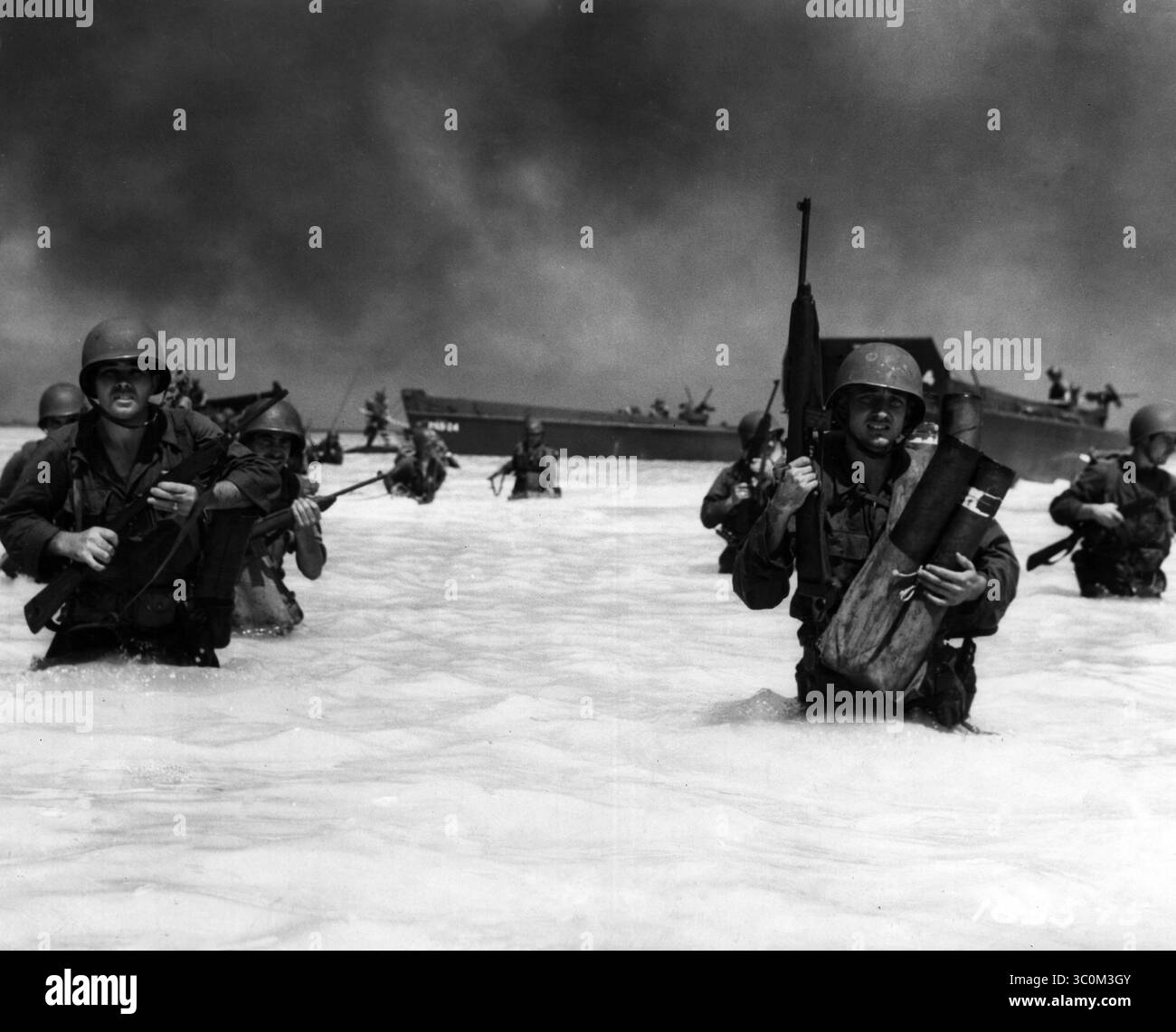 American soldiers of the 165th Infantry Regiment advancing in the ...