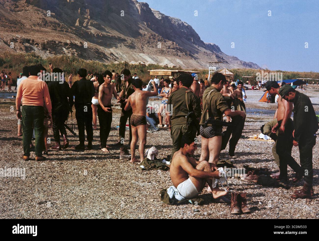 Israeli soldiers, armed with machine guns, on the Dead Sea coast. Not ...