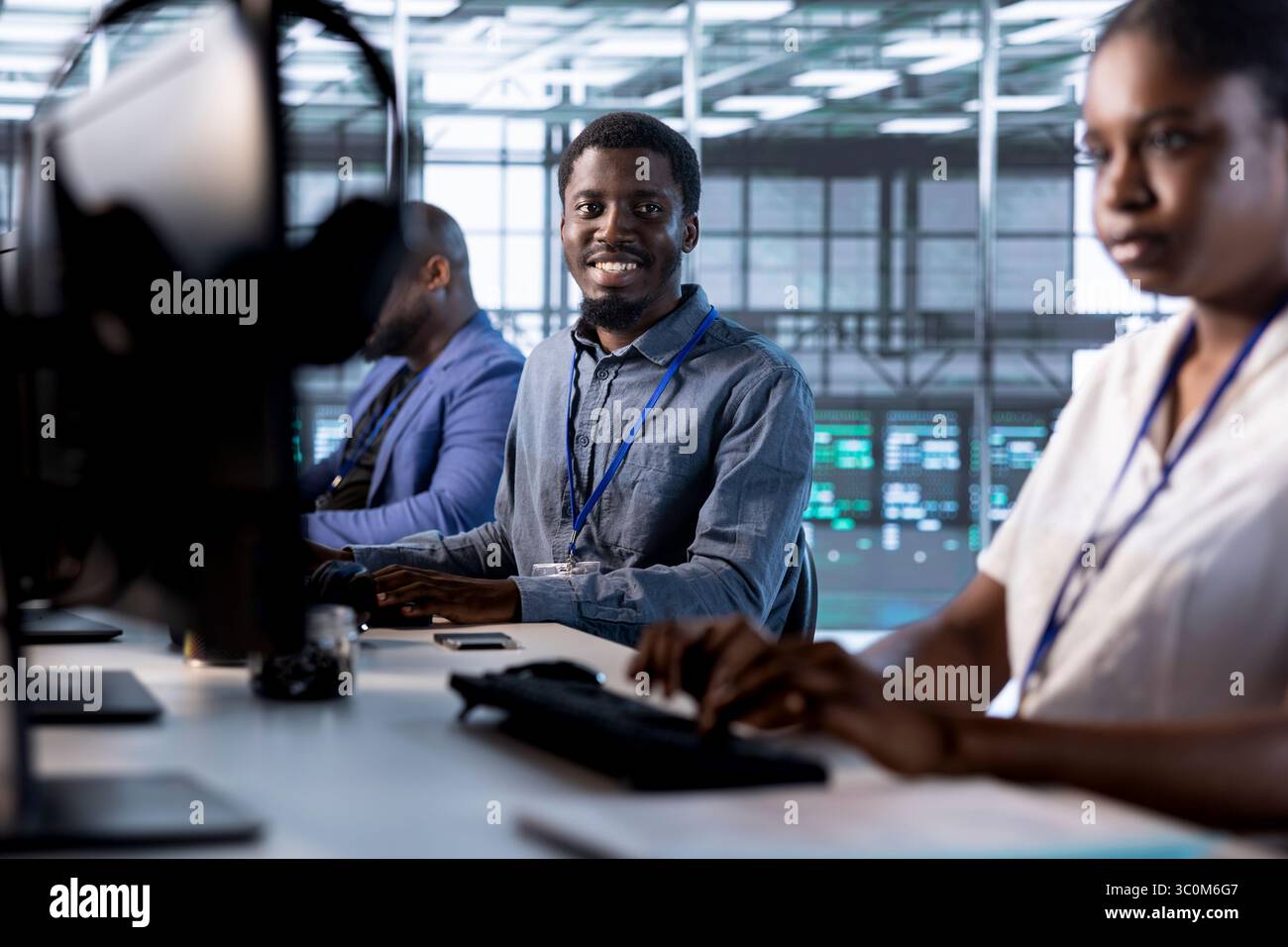 Happy data center coworkers monitoring hi-res stock photography and ...
