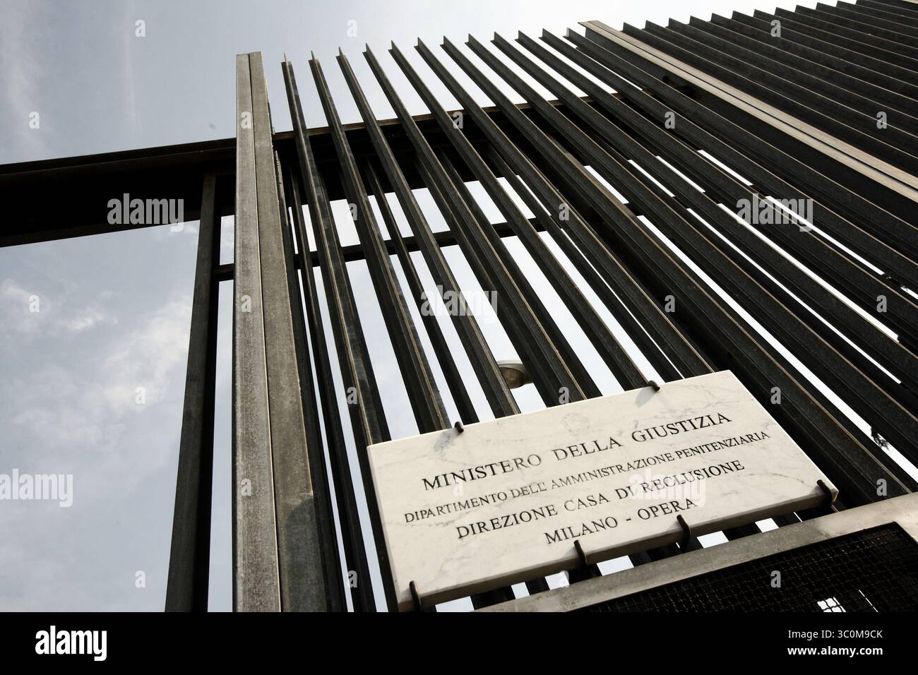 The plaque and the high gate at the entrance of Opera district prison ...