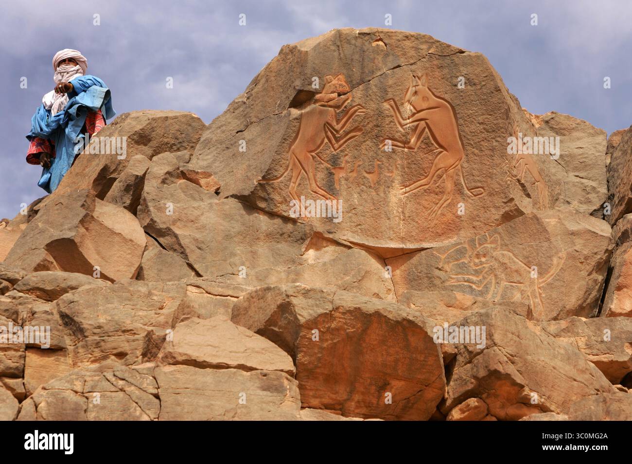 Tuareg posing beside the The Fighting Cats (Meercatze) in the ...