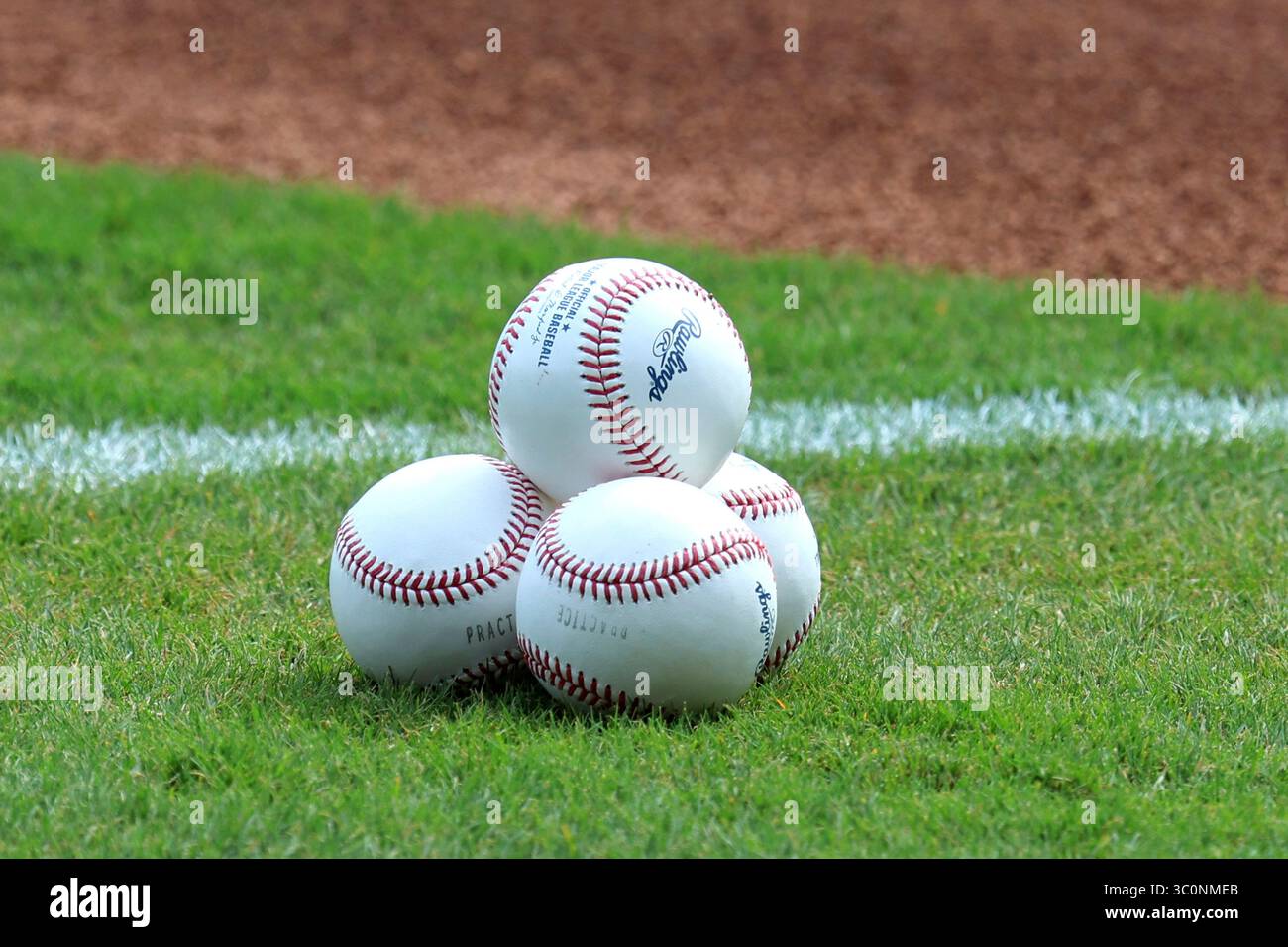 ATLANTA, GA - JULY 19: Rawlings baseballs sit on the baseball field ...
