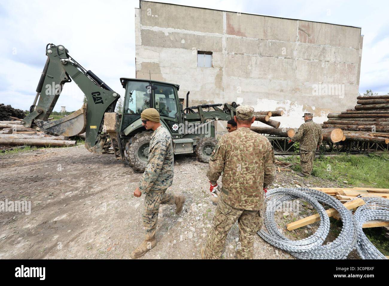 Marines and Latvian Engineers Cut Lumber for Trench Support - BALTOPS ...